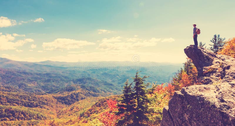 Man Walking on the Edge of a Cliff Stock Photo - Image of peak ...