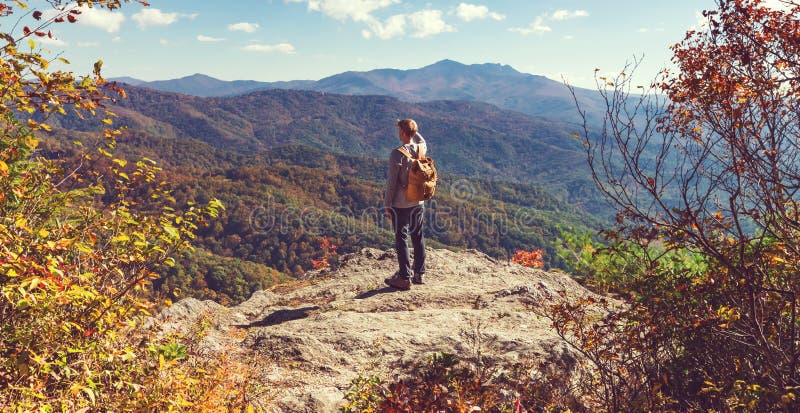 Man Walking on the Edge of a Cliff Stock Image - Image of leaves, hike ...