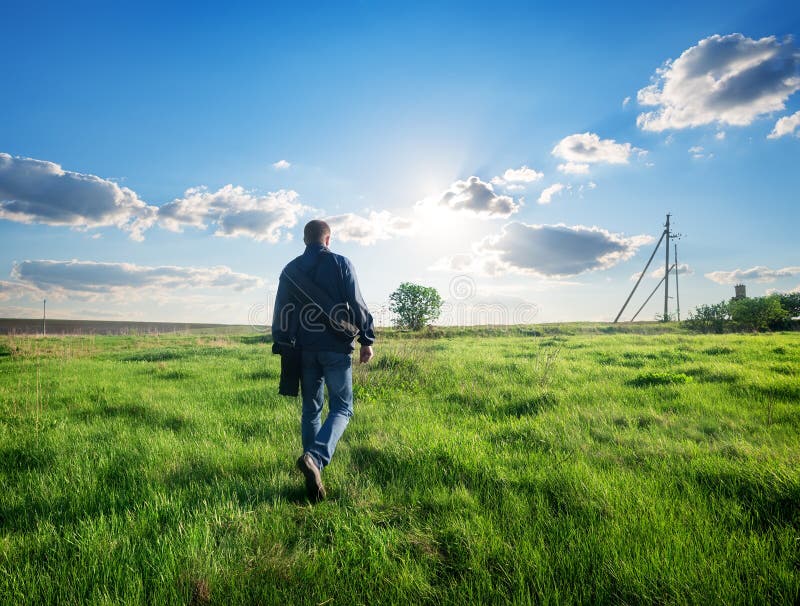 Man walking on the field stock image. Image of grass - 39699247