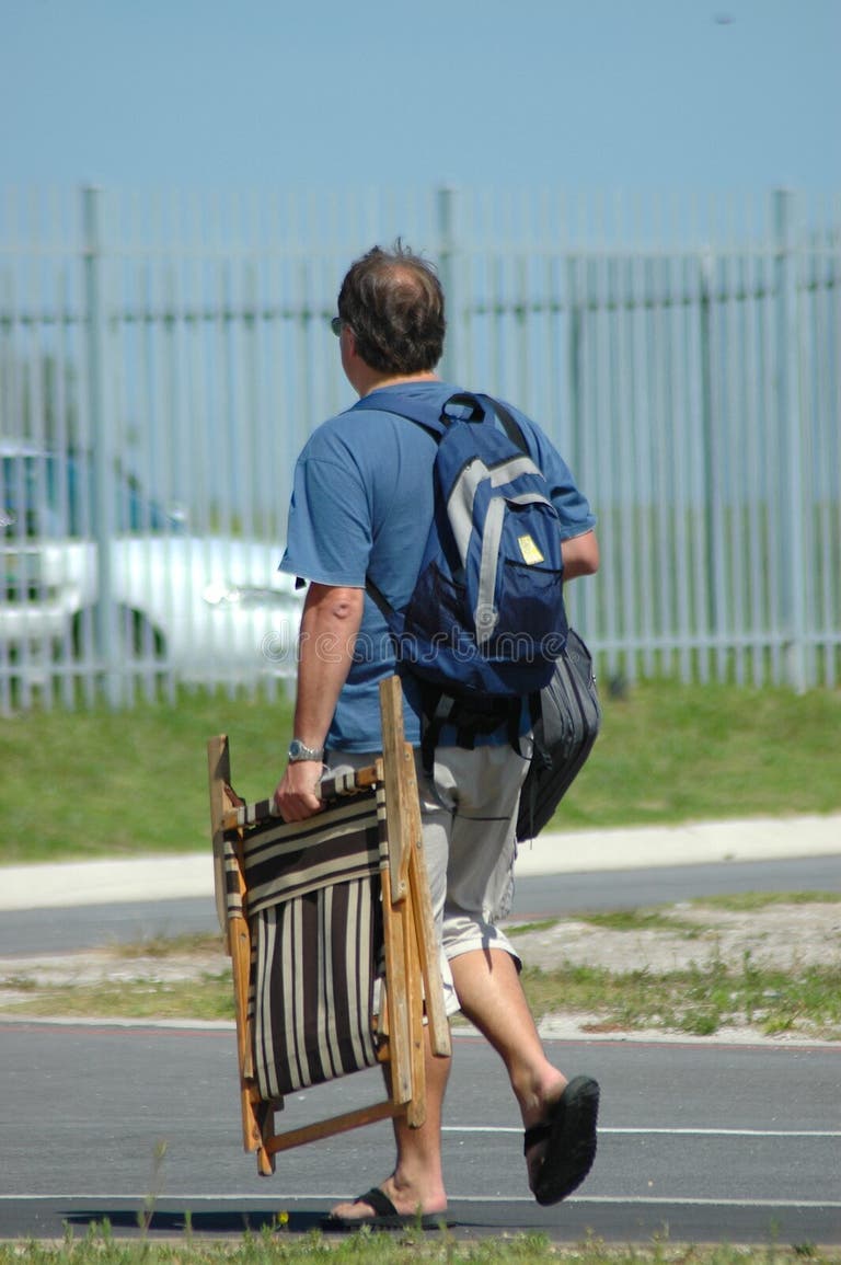 577 Man Carrying Chair Stock Photos - Free & Royalty-Free Stock Photos ...