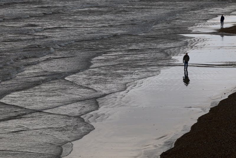 Man Walking on Monotone Beach in Brighton Editorial Image - Image of ...