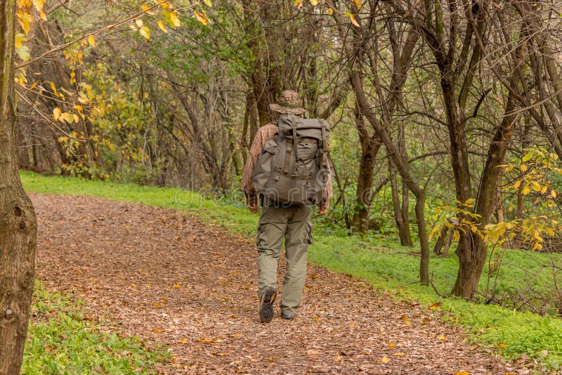 Man Walking in Nature with Backpack Stock Photo - Image of leisure ...