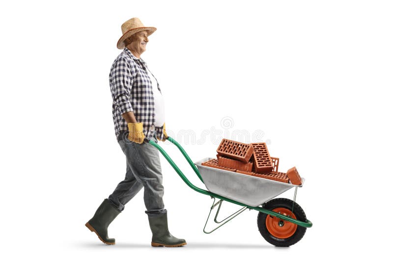Man Walking and Pushing Bricks in a Wheelbarrow Stock Photo - Image of ...