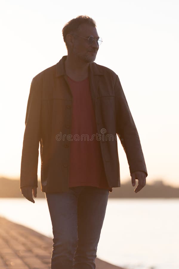 Single Man Walking on River Edge Stock Photo - Image of memory ...