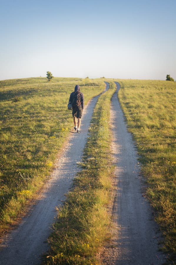 Man walking on the road stock photo. Image of male, nature - 123132212