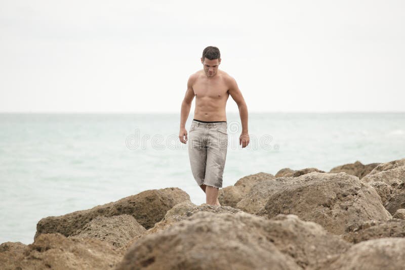 Man walking on the rocks stock image. Image of caucasian - 14326229