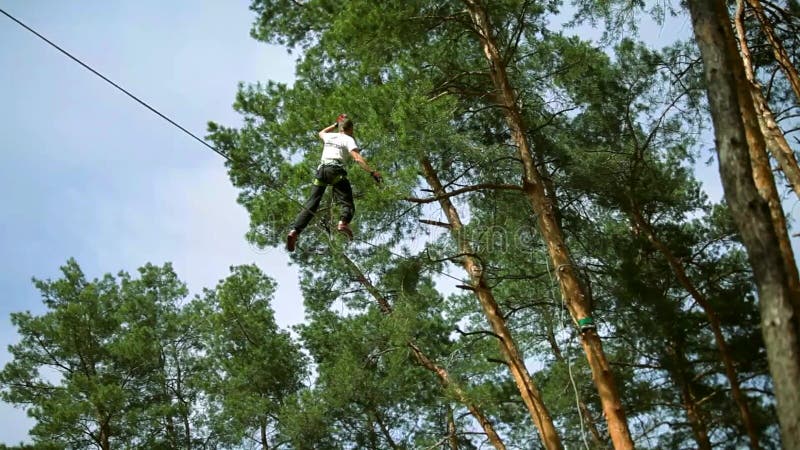 Man Walking on a Rope Over an Abyss and Balances Stock Video - Video of ...