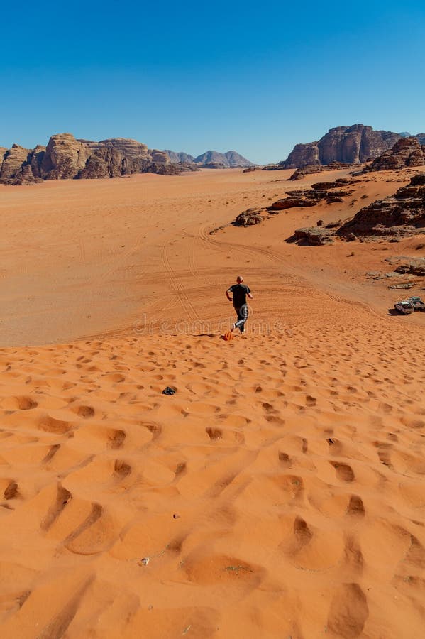 Man Walking on Sand in JORDAN Editorial Stock Image - Image of gray ...