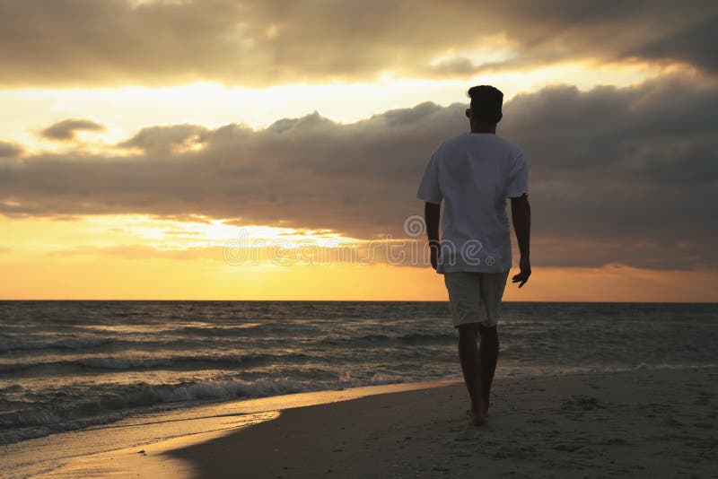 Man Walking on Sandy Beach during Sunset, Back View Stock Photo - Image ...