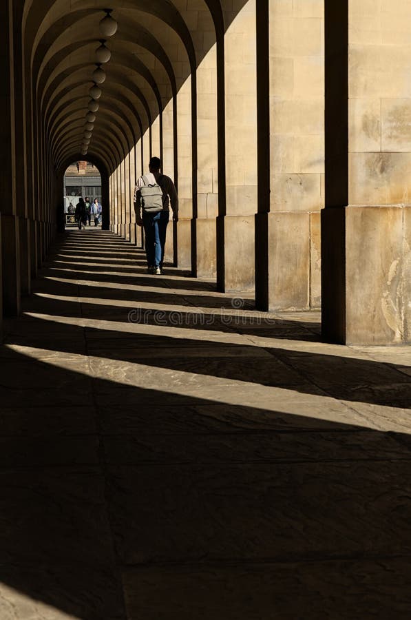 A Man Walking through Shadow and Light. Editorial Stock Image - Image ...