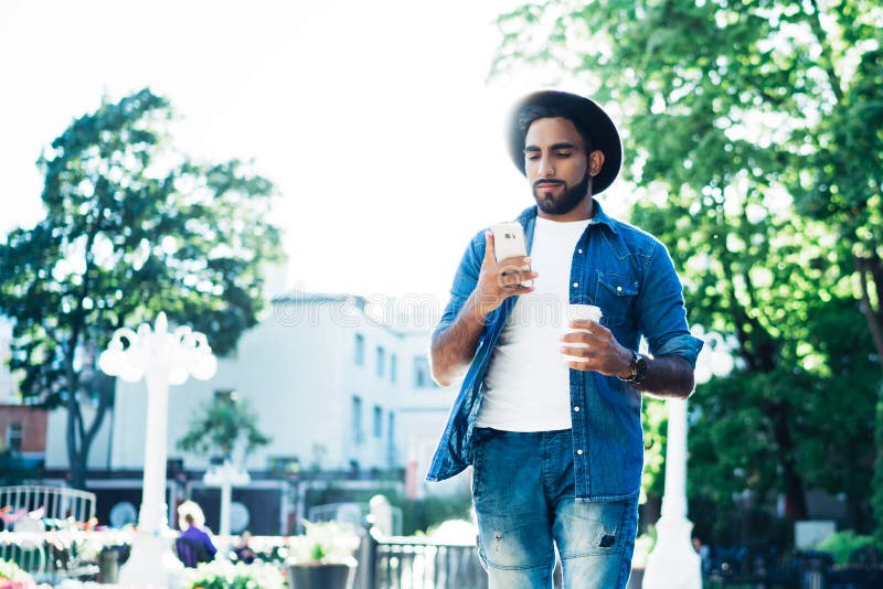 Man Walking with Smartphone on Street Stock Image - Image of phone ...