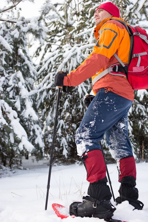 A Man Walking in the Snow with a Backpack. Stock Image - Image of ...