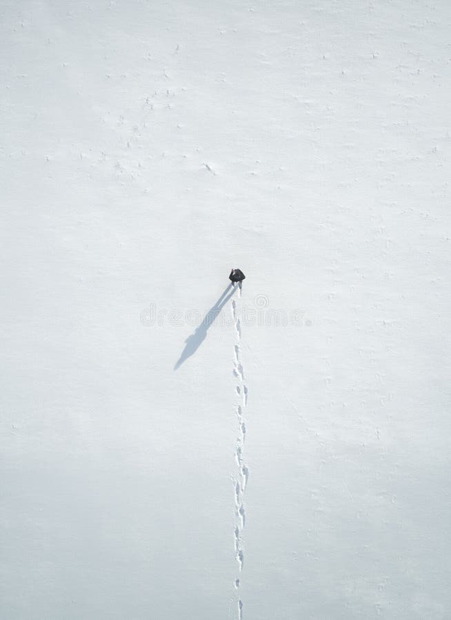 Man Walking on the Snow with Its Footprints Behind Stock Image - Image ...