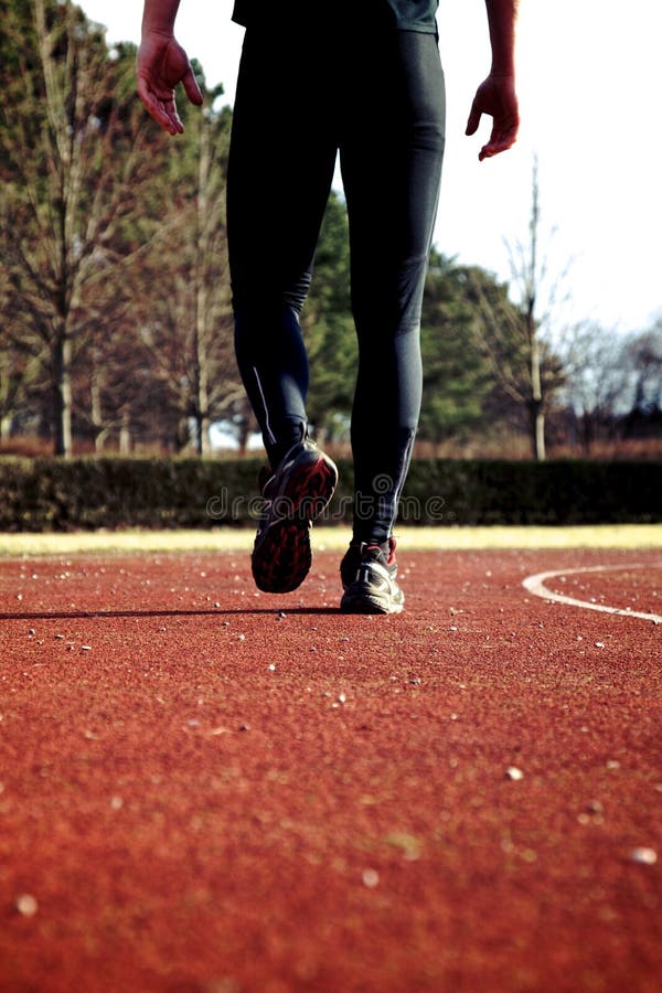 Man walking on sportstrack stock photo. Image of power - 18902204
