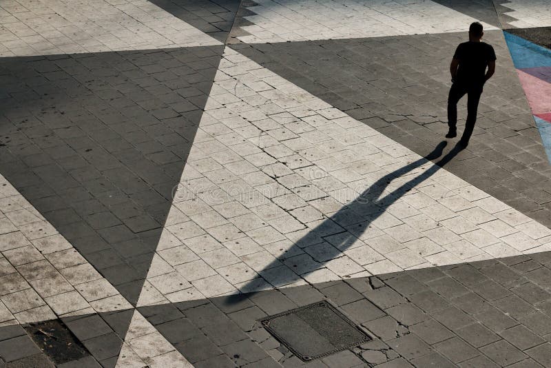 Man walking in square editorial stock photo. Image of geometric - 102239843