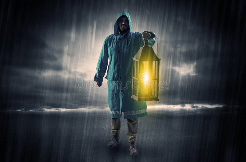 Man Walking in Storm with Lantern Stock Image - Image of coming, male ...