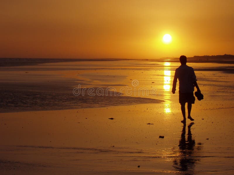 Man walking at sunset stock image. Image of vacation, relax - 1402851