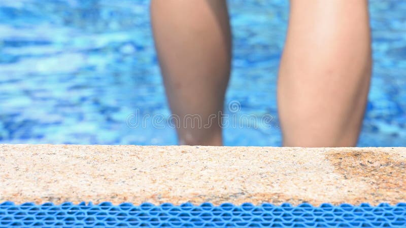 Man Walking into Swimming Pool Stock Footage - Video of resort, rippled ...