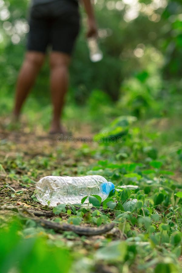A Man Walking and Throw Garbage at Forest Stock Photo - Image of park ...