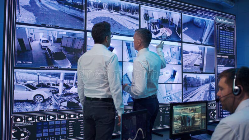 Men Discussing Security Footages in Office Stock Image - Image of ...