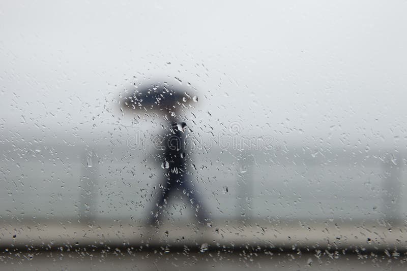 Sad Man Walking In The Rain