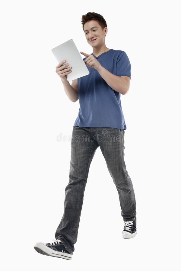 Man Walking while Using Digital Tablet. Conceptual Image Stock Photo ...