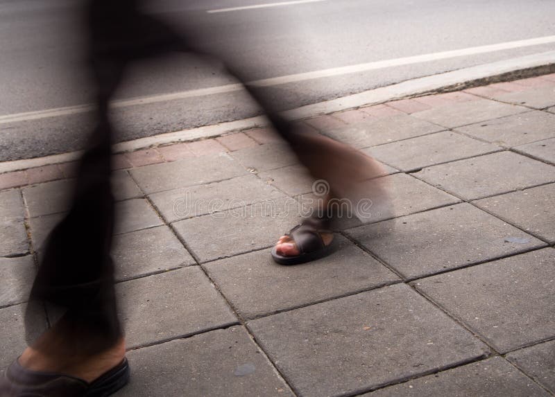 A man walking on walkway stock photo. Image of person - 74013460