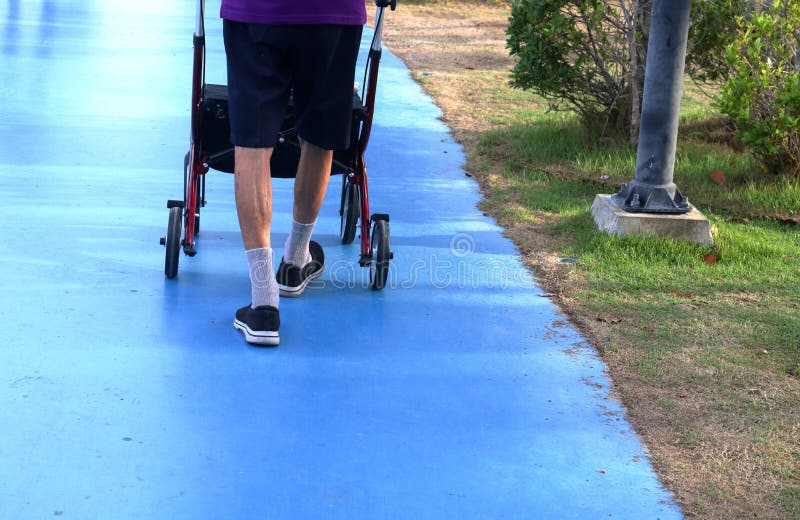 Man Walking with Wheeling Walker on Path. Stock Image - Image of people ...