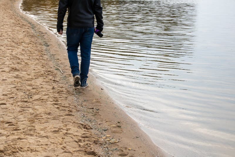 Man Walks Along Sandy Bank River Stock Photos - Free & Royalty-Free ...