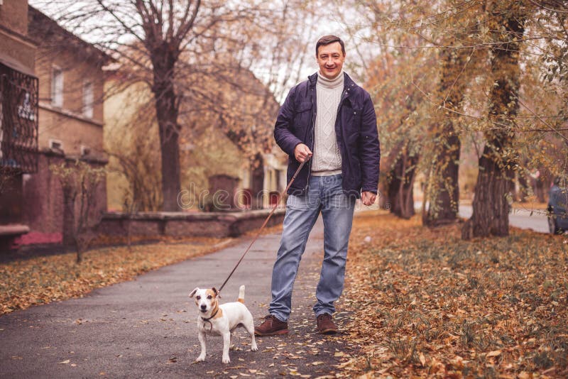 Man walks with his dog stock image. Image of beard, leash - 200189789
