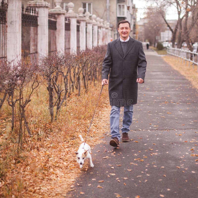 Man walks with his dog stock photo. Image of life, model - 201694046