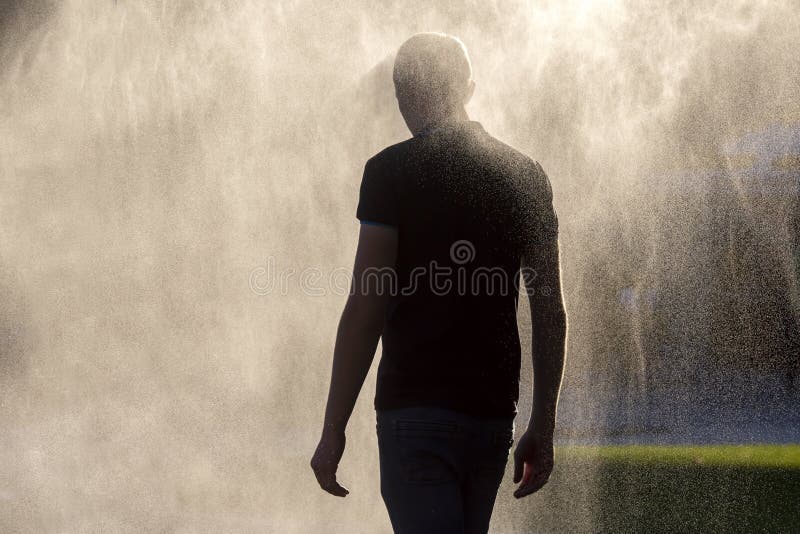 Man Walks in a Thick Fog of Water Drops Stock Photo - Image of light ...