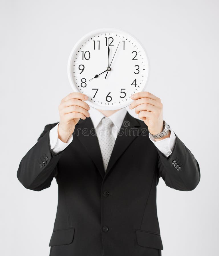 Man with wall clock stock photo. Image of schedule, male - 32284802