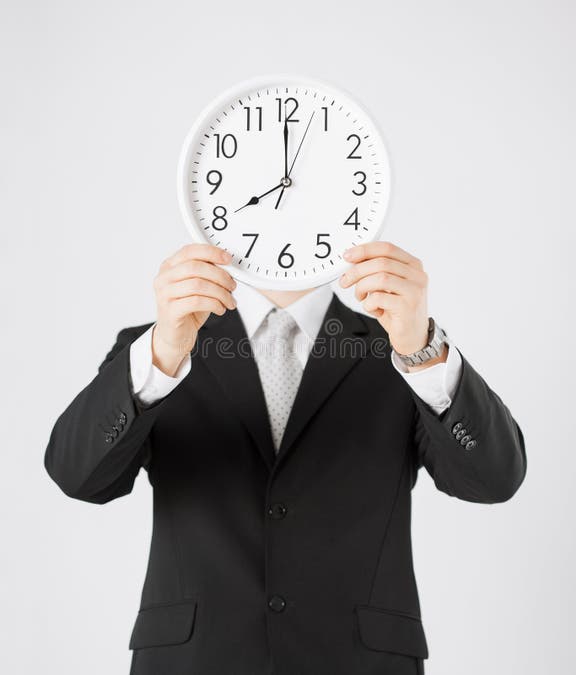 Man with wall clock stock photo. Image of schedule, male - 32284802