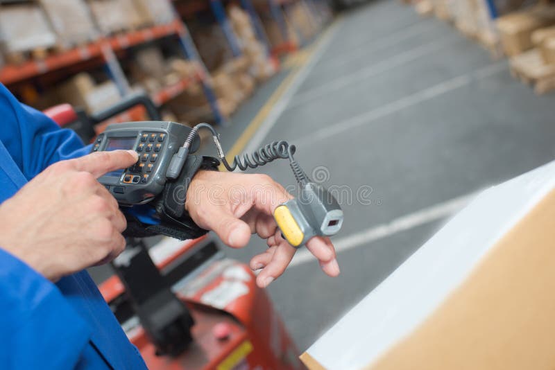 Man in Warehouse Wearing Handheld Scanner and Computer Stock Photo ...