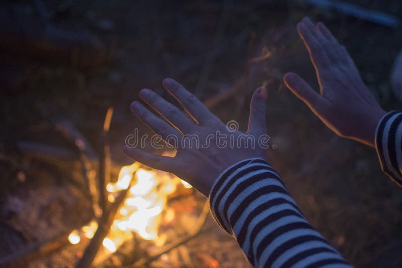 Fire warms up hands stock photo. Image of night, human - 110218114