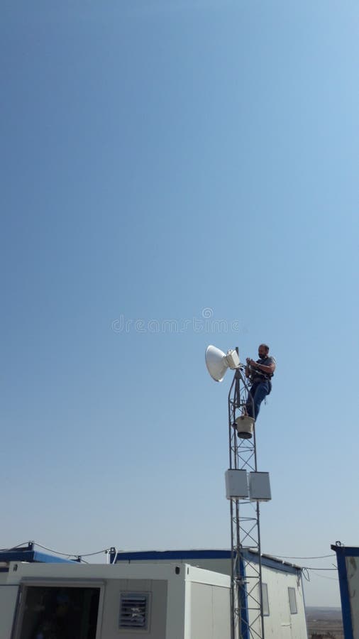 A Man Was in the Tower for Installation of Antenna at Outdoor Area ...