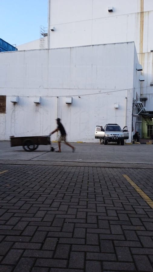 A Man Was Push the Booth beside the Building Stock Photo - Image of ...