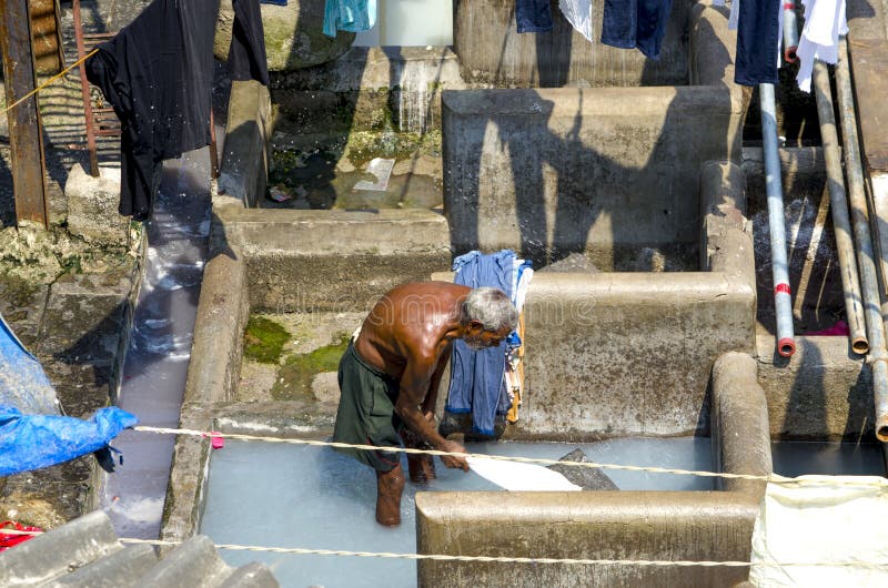 The man washes clothes editorial photography. Image of places - 64720002