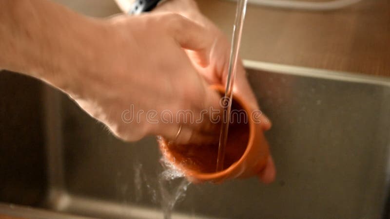 Man washes a cup stock video. Video of indoors, domestic - 51293697