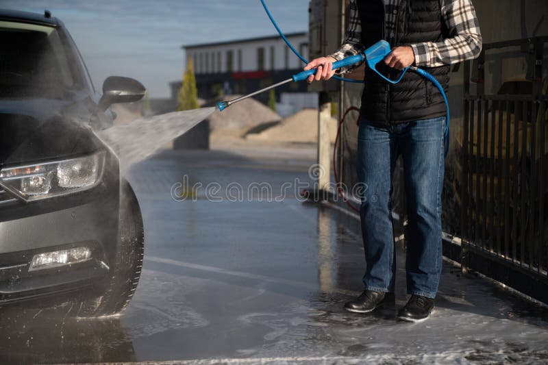 A Man Washes His Car at a Car Wash. Self Service Car Wash. Stock Image ...