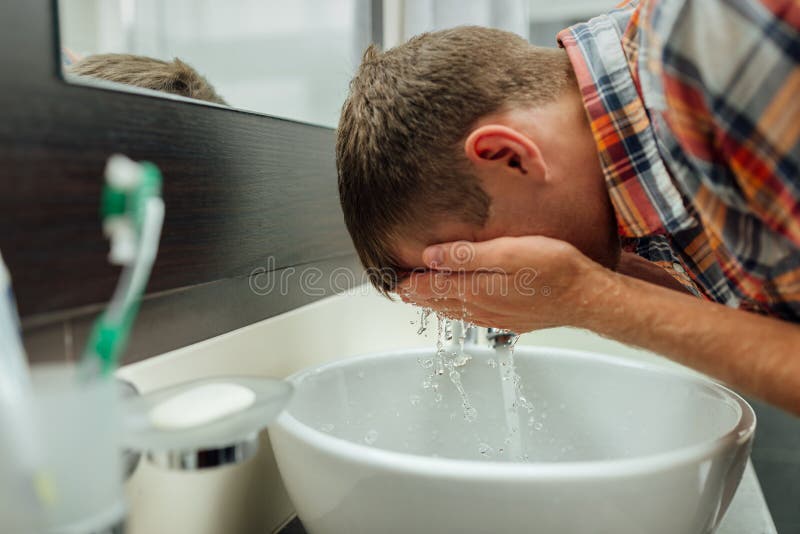 Man Washes His Face in the Bathroom Stock Image - Image of bathroom ...