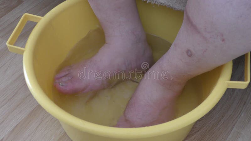 A Man Washes His Feet in Water in a Basin Stock Footage - Video of ...