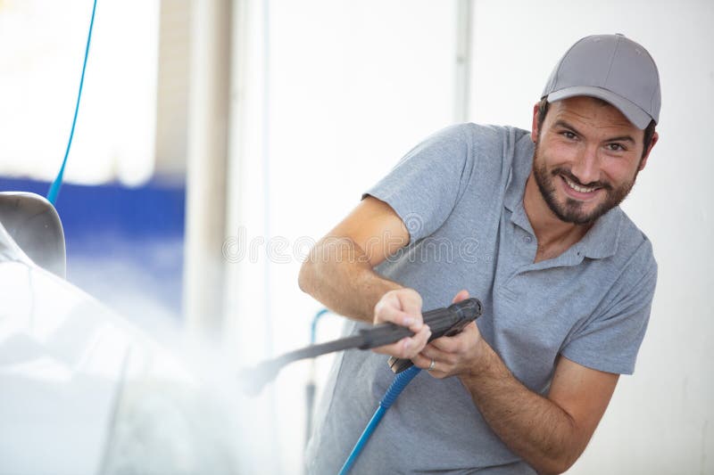 Man washing clients car stock image. Image of auto, washing - 296716455