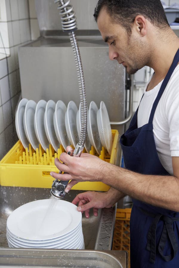 Man washing dishes stock photo. Image of tray, dishes - 7562106
