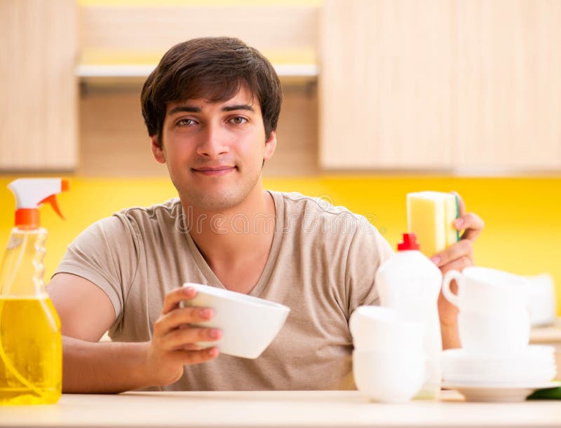 Man washing dishes at home stock image. Image of foam - 179704847