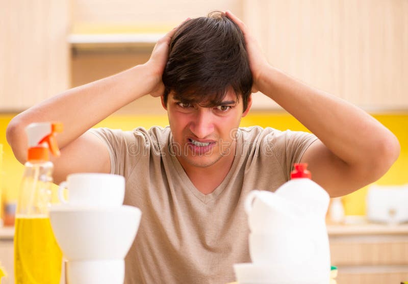 Man washing dishes at home stock photo. Image of husband - 188632144