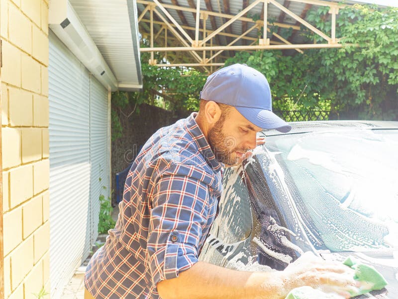 Man Washing His Black Car Near House. Stock Photo - Image of automobile ...