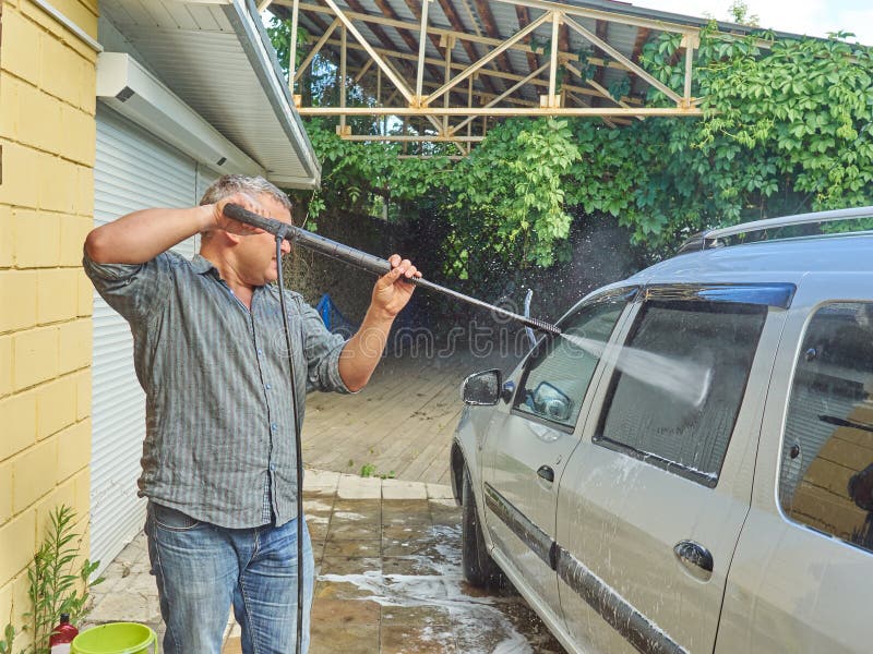 Man Washing His Silver Car Near House. Stock Image - Image of silver ...