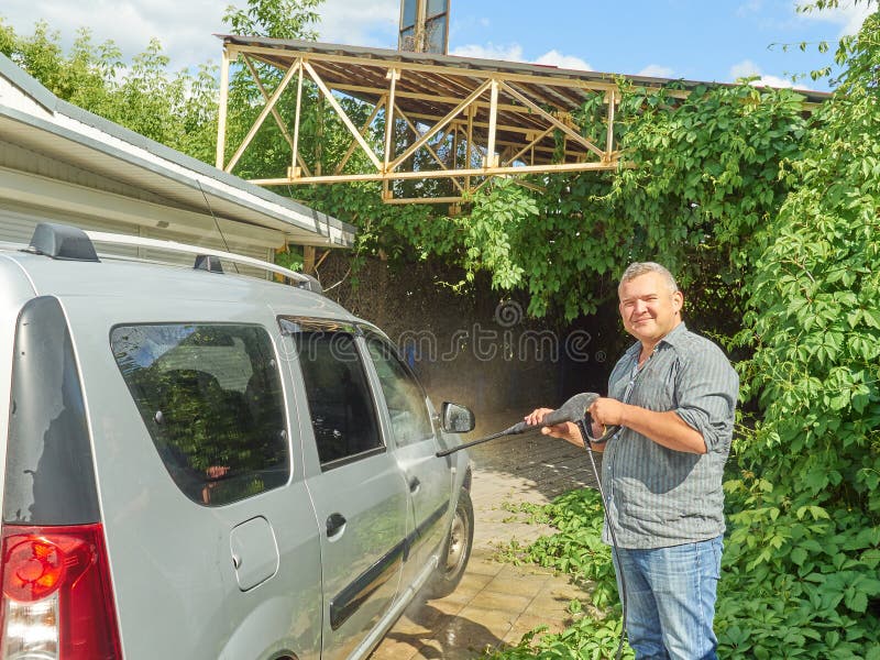 Man Washing His Silver Car Near House. Stock Photo - Image of employee ...